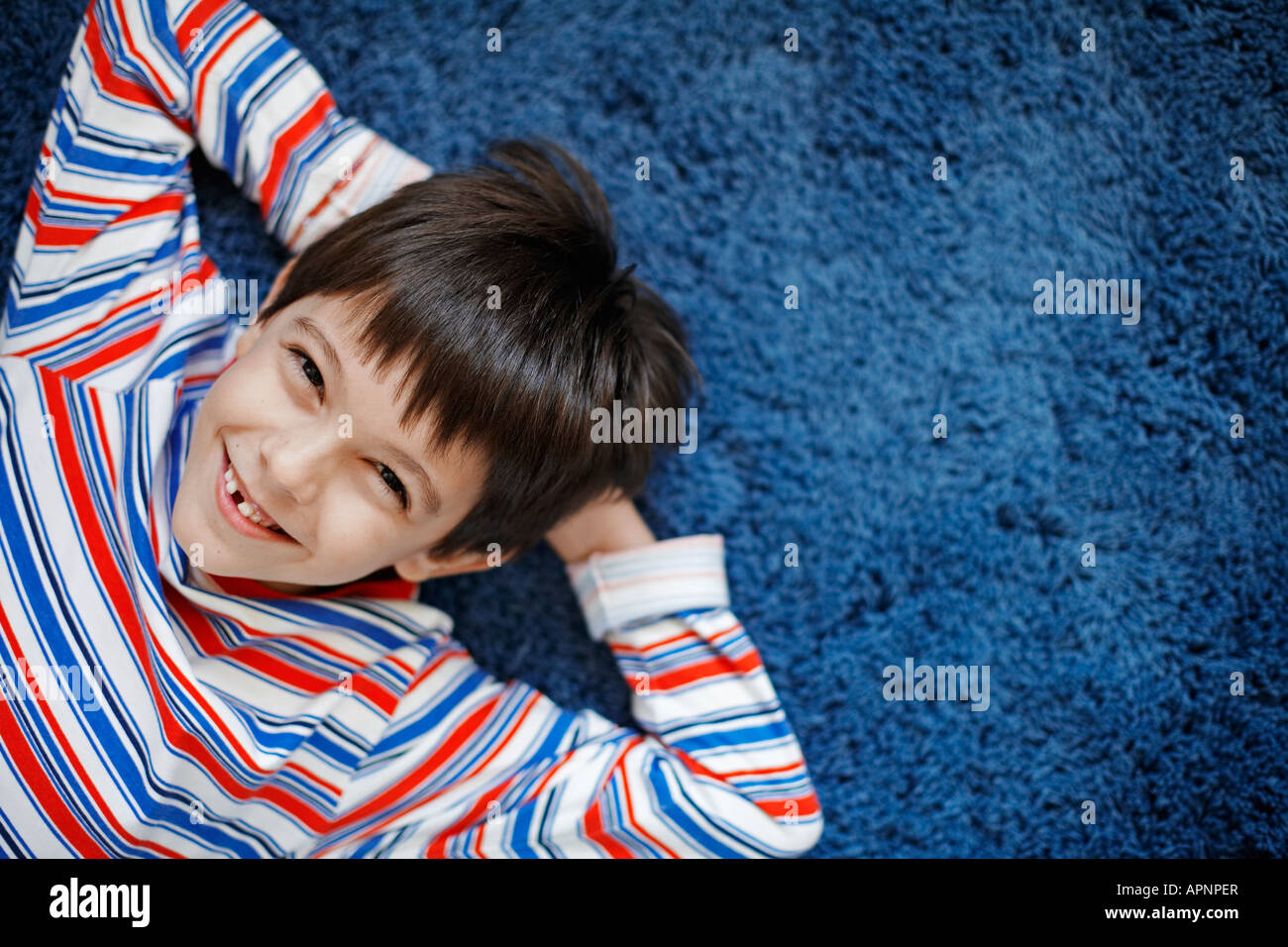 Boy Lying On Back Stock Photo - Alamy