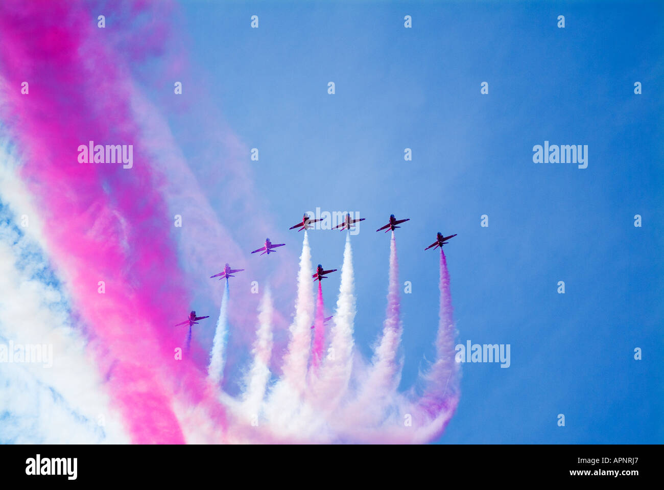 Red Arrows trailing smoke Stock Photo - Alamy