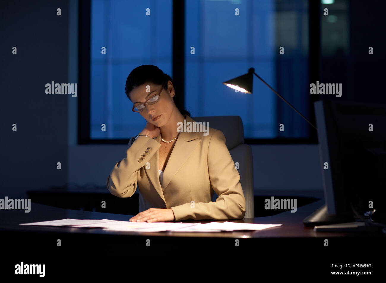 Female office worker working late Stock Photo - Alamy