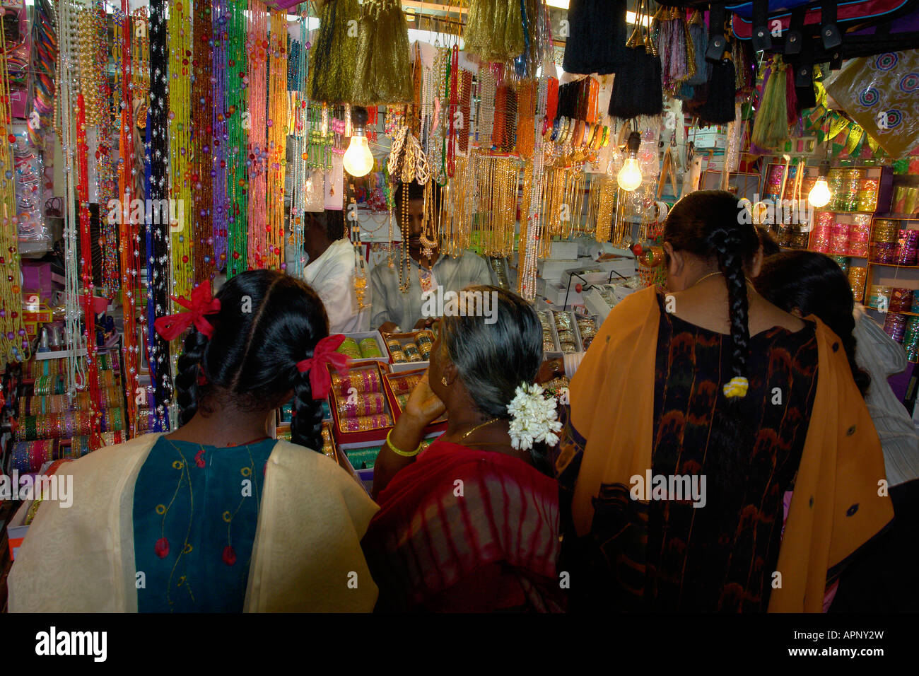 indian women shopers at a store in the madurai market at night Stock ...