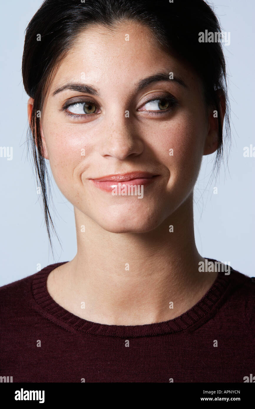 Young woman looking sideways Stock Photo - Alamy