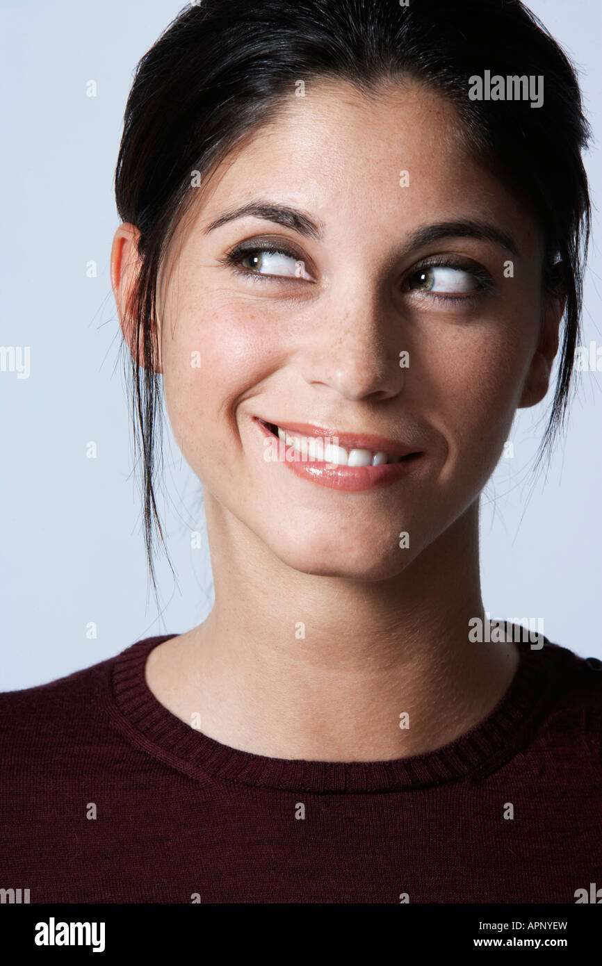 Young woman looking sideways Stock Photo - Alamy