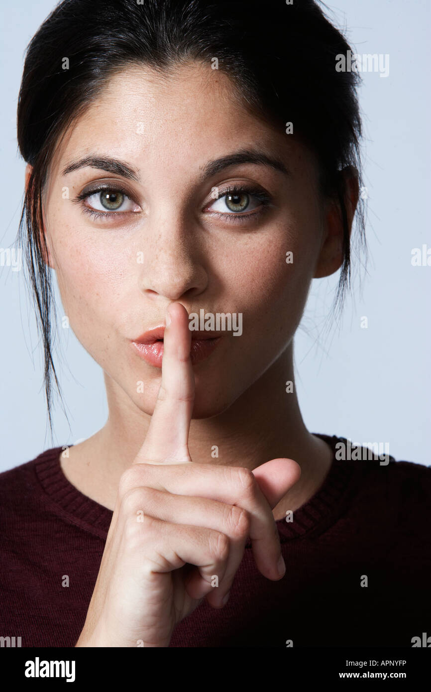 Face One Finger Over Mouth High Resolution Stock Photography and Images ...