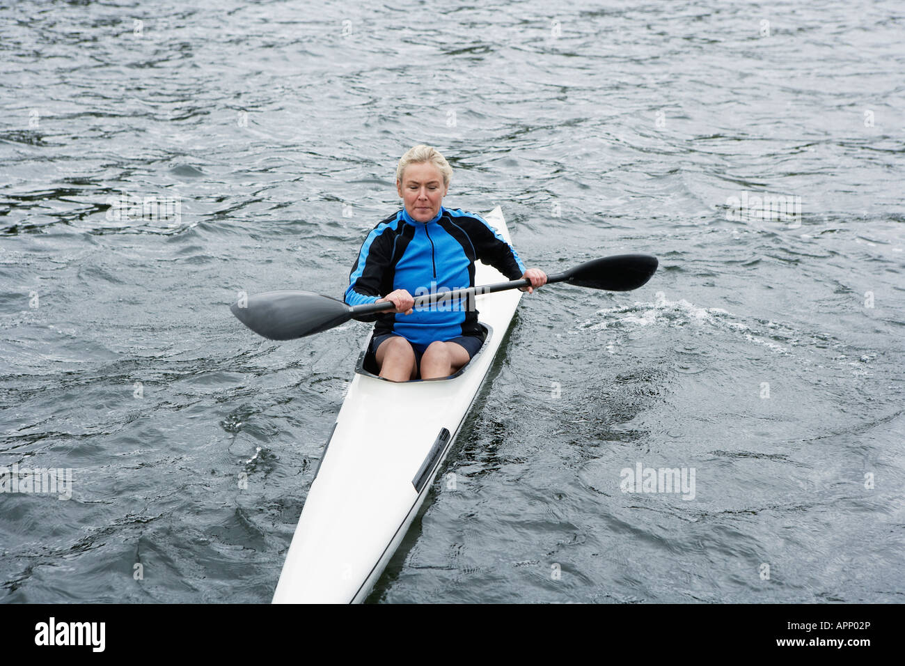 Mature woman kayaking Stock Photo - Alamy