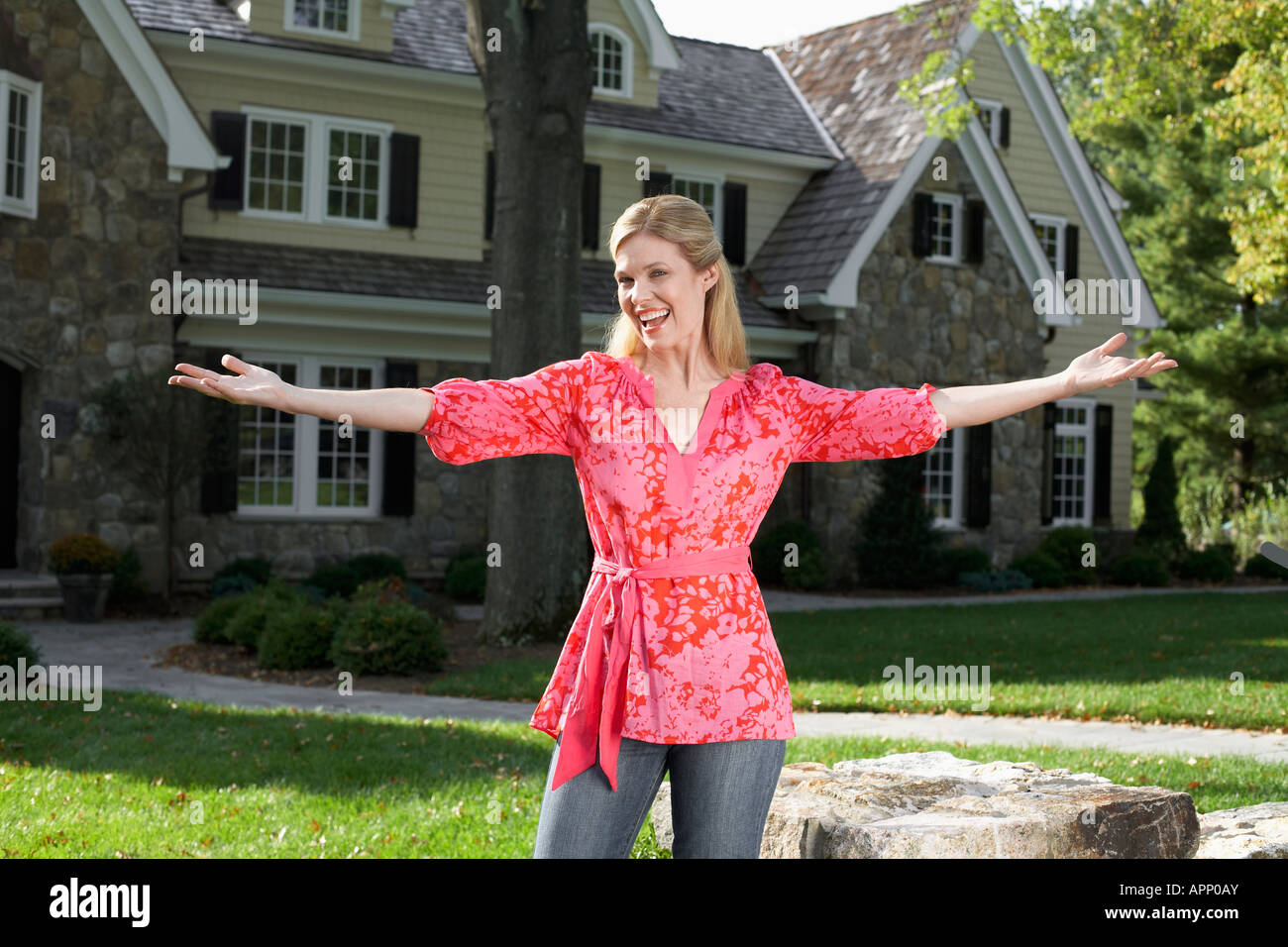 Woman showing off house hi-res stock photography and images - Alamy