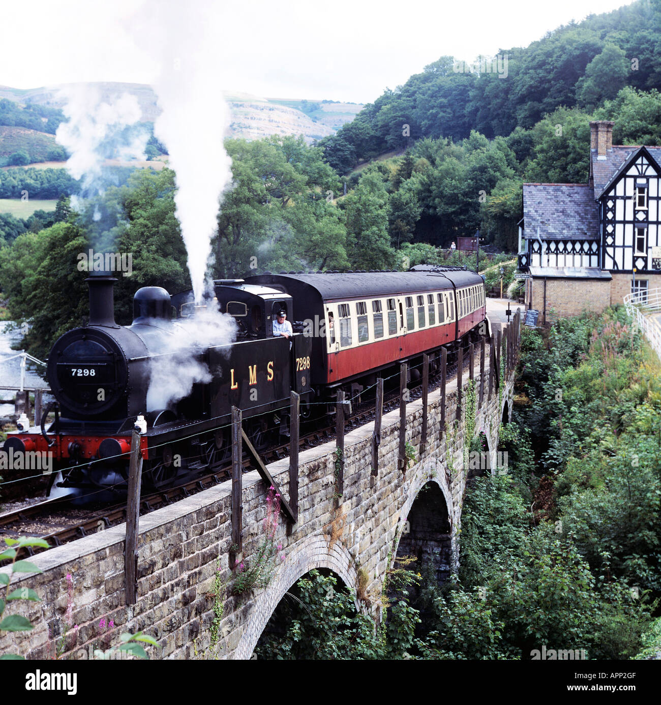 A steam train crossing a viaduct at Berwyn station on Llangollen ...