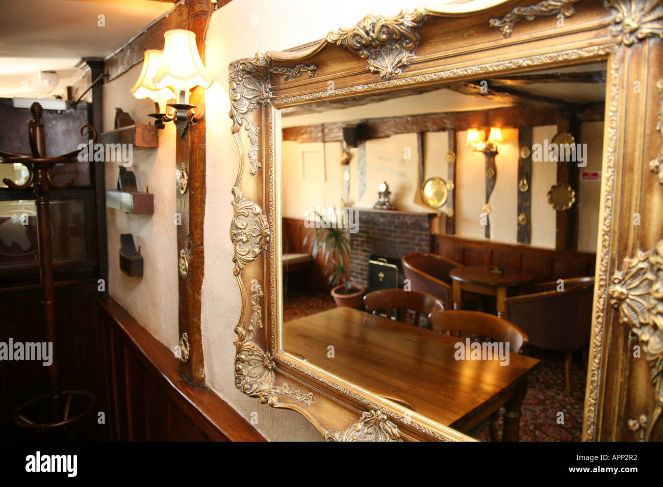 The reflection of a pub in a mirror on a wall Stock Photo - Alamy