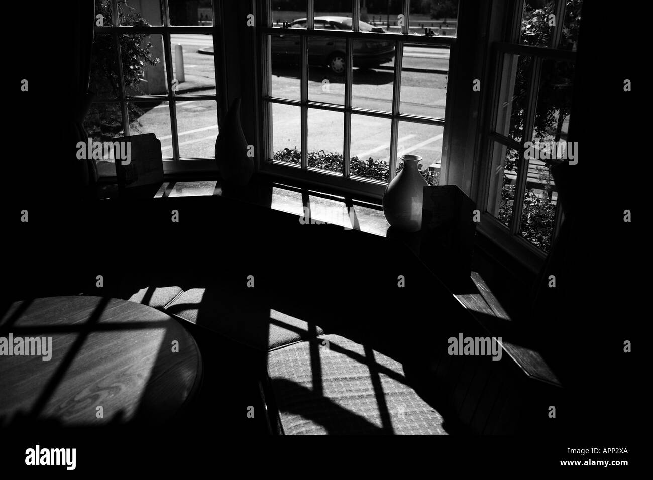 Beautiful light comming through a window into a interior of a room in a ...