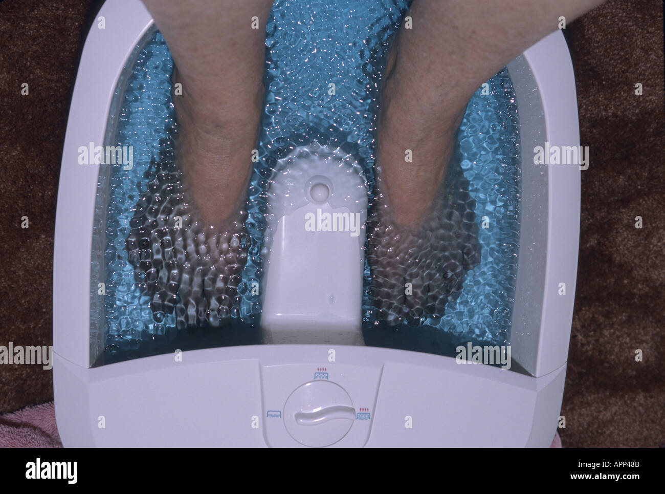 Soaking ones feet Stock Photo - Alamy