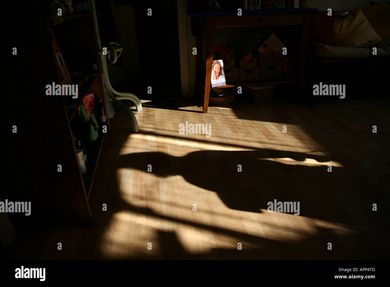 A sinister shadow of a person on a floor in a room Stock Photo - Alamy