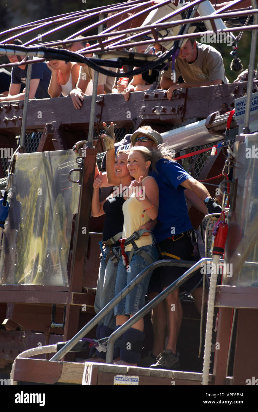 Two girls bungee jumping in tandem from the A J Hackett Bridge over the ...