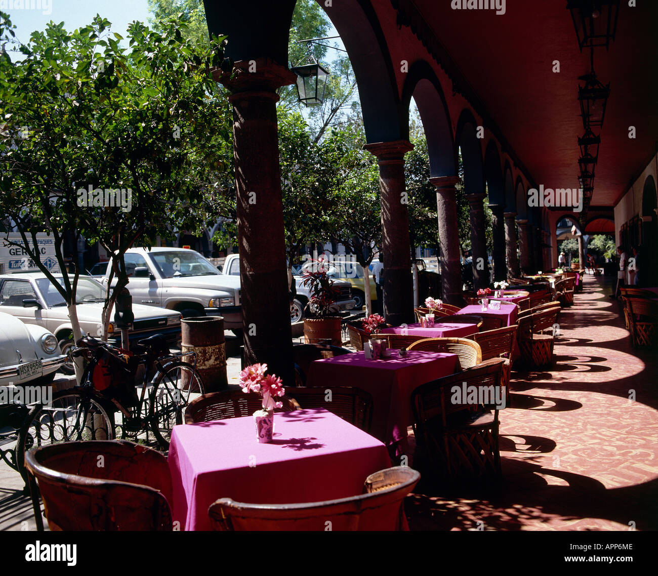 Tables and chairs lining the colonial arcades at a restaurant in the ...