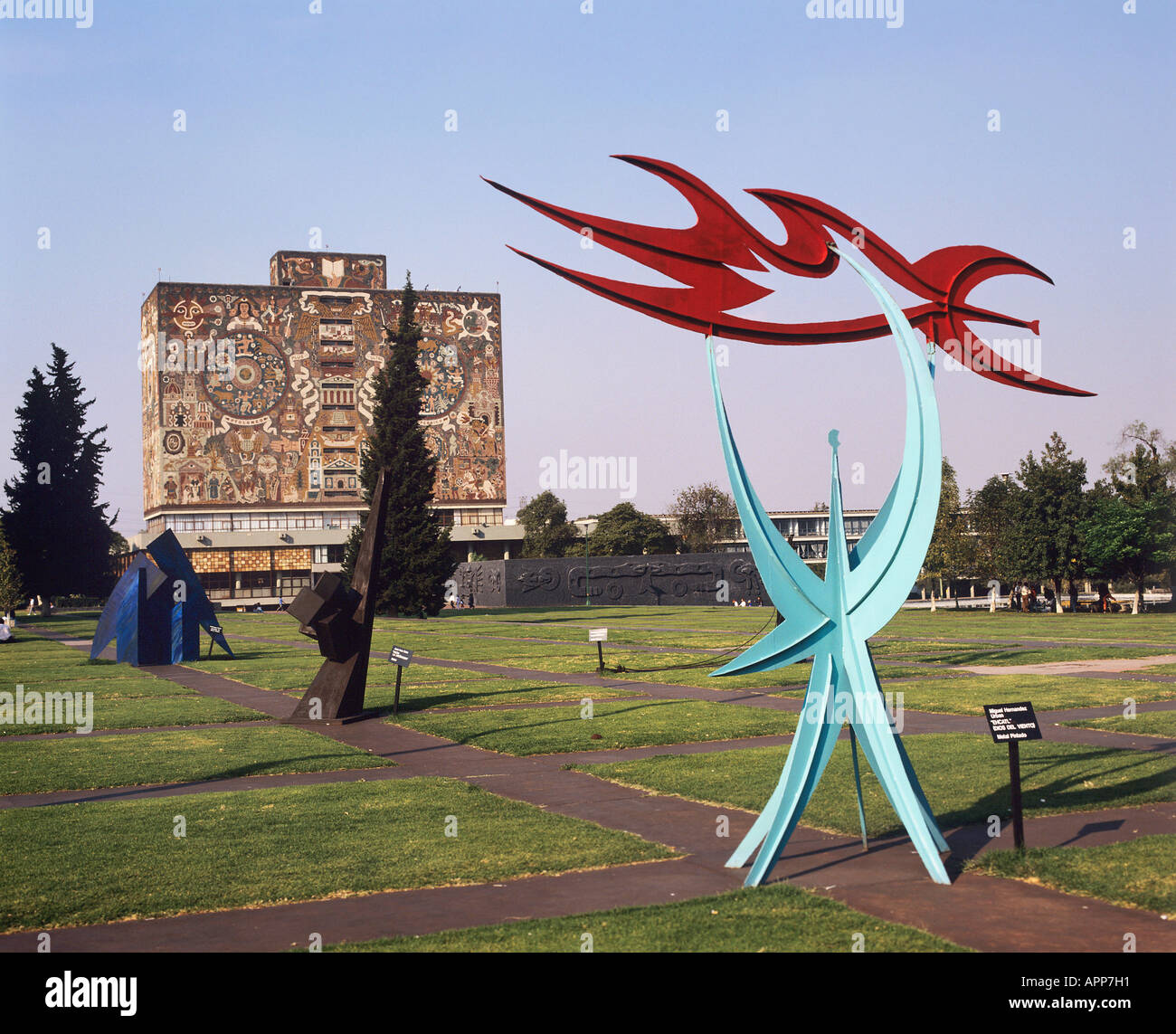 Modern steel sculpture on the tree lined campus of the University of ...