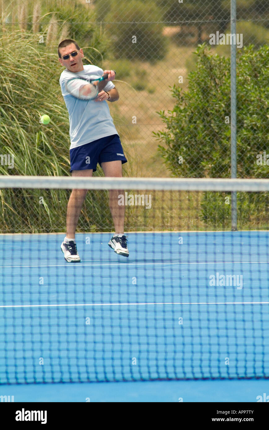 Tennis player at tennis court Stock Photo - Alamy