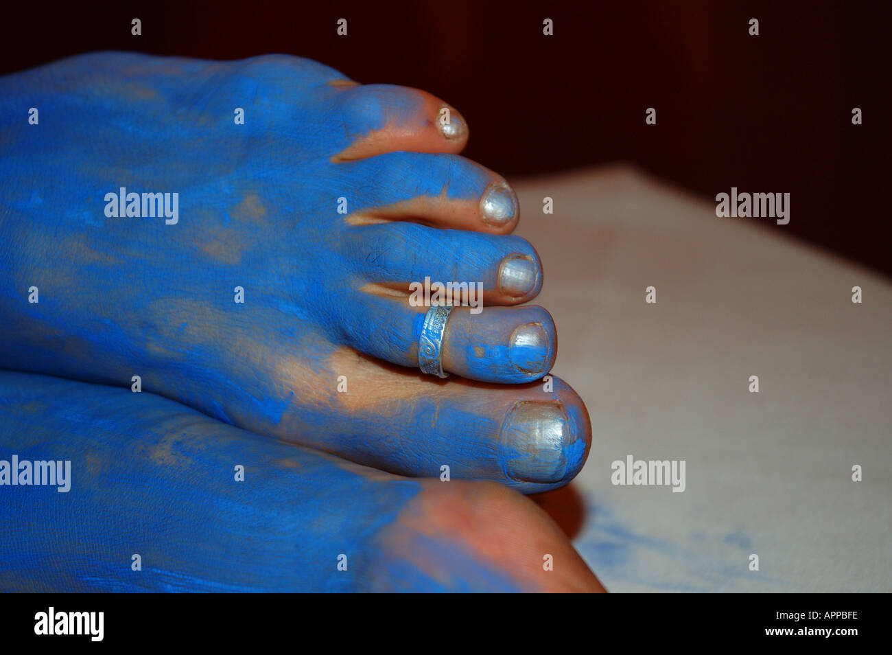 blue painted foot bodyart featival dsc 8747 Stock Photo - Alamy