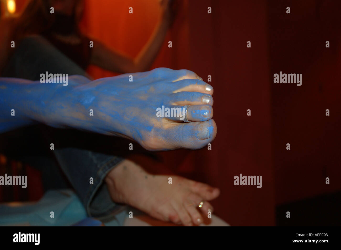 blue painted foot bodyart featival dsc 8748 Stock Photo - Alamy