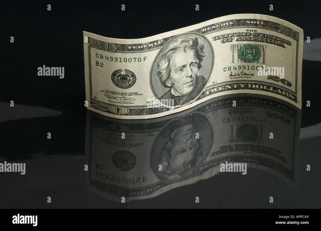 American 20 dollar note and its mirror reflection Stock Photo - Alamy