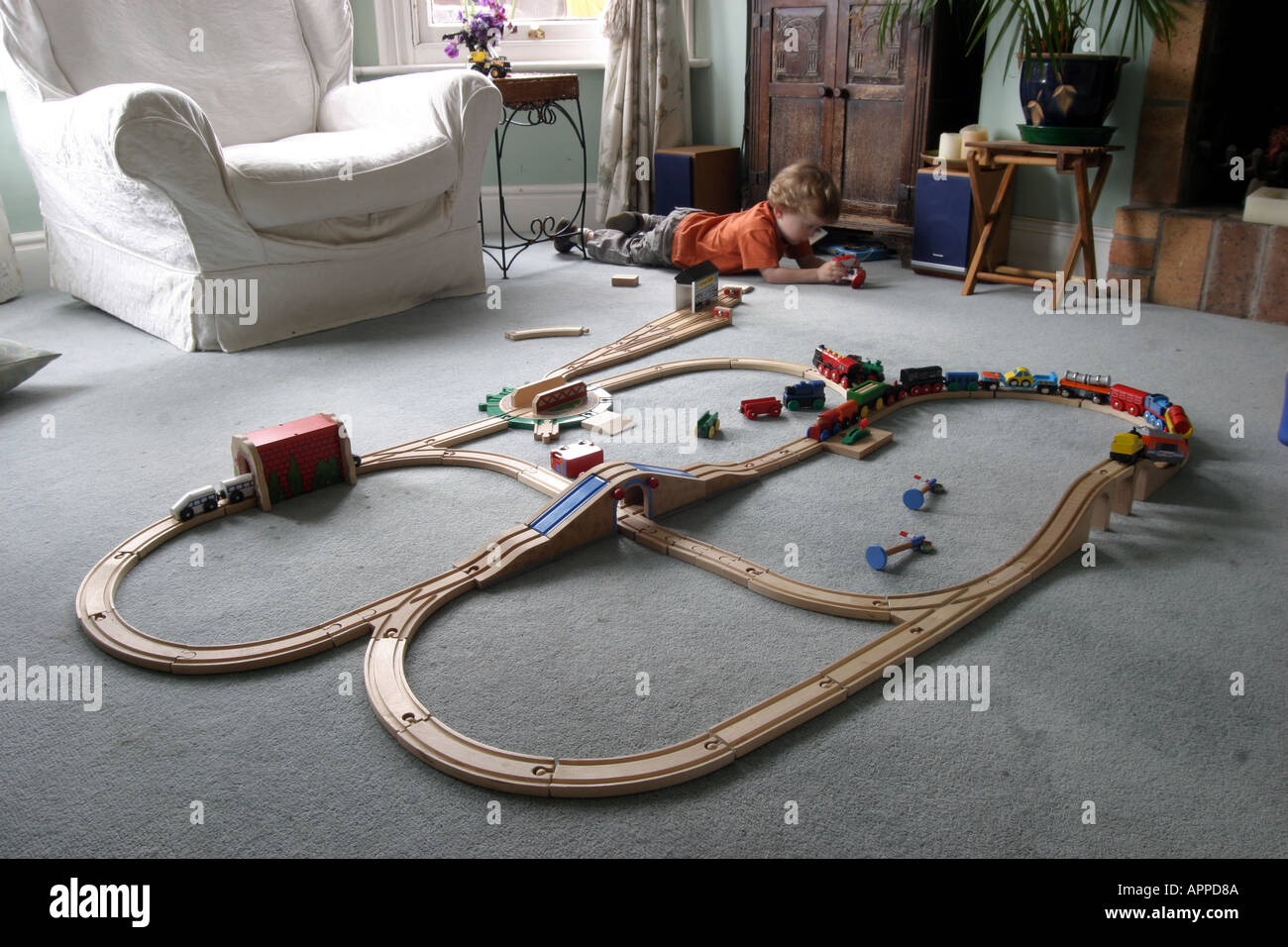 Lewis aged three and his wooden trainset Stock Photo - Alamy