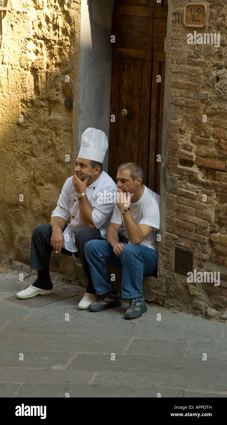 Two chefs take a break before the lunch rush at San Gimignano, in ...