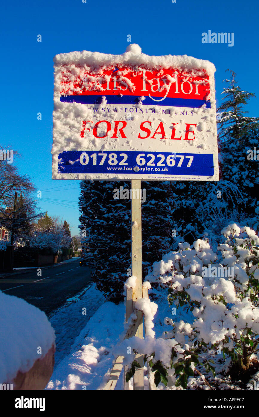 Estate Agents for Sale Sign in Snow Stock Photo - Alamy