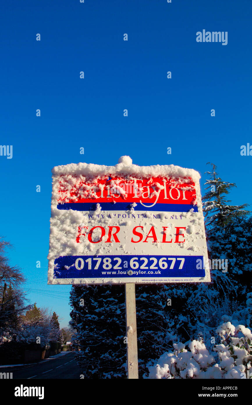Estate Agents for Sale Sign in Snow Stock Photo - Alamy