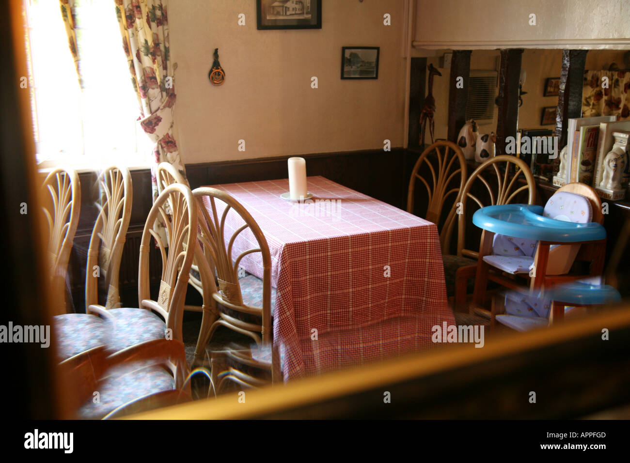 Reflection of a table in a mirror at a quirky pub Stock Photo - Alamy