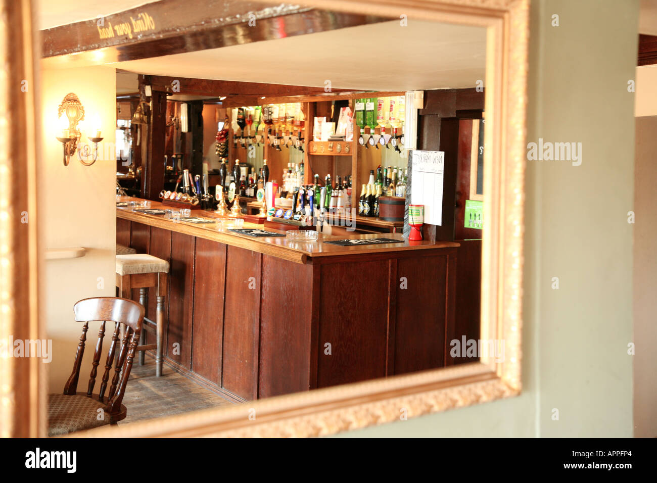 a reflection of a bar in a pub on a mirror Stock Photo - Alamy
