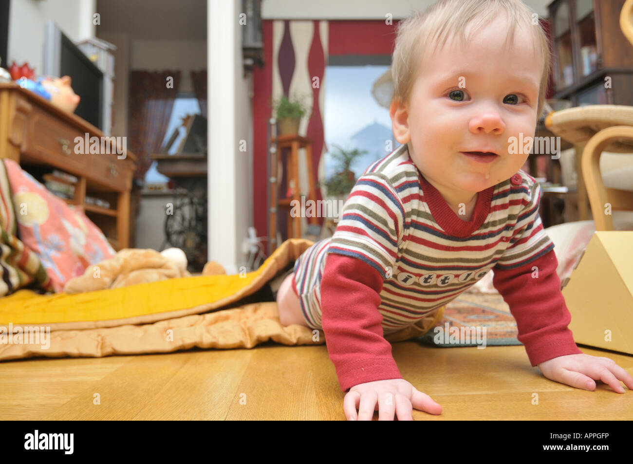 Curious baby boy lying hi-res stock photography and images - Alamy