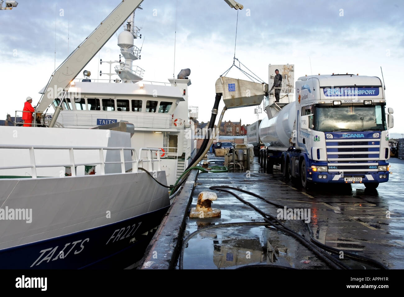 Trawler unloading fish into tanker hi-res stock photography and images ...