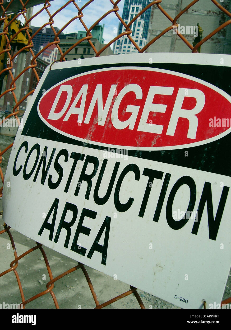Industrial Scene With a Danger Construction Area Sign on a Chain Link ...