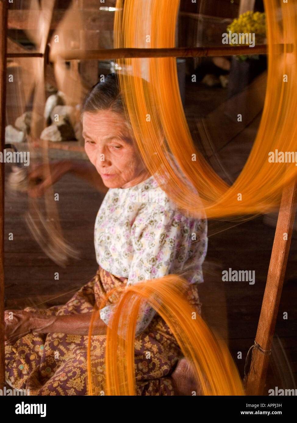 old woman weaving lotus threads into silk at Inle Lake in Myanmar Stock ...