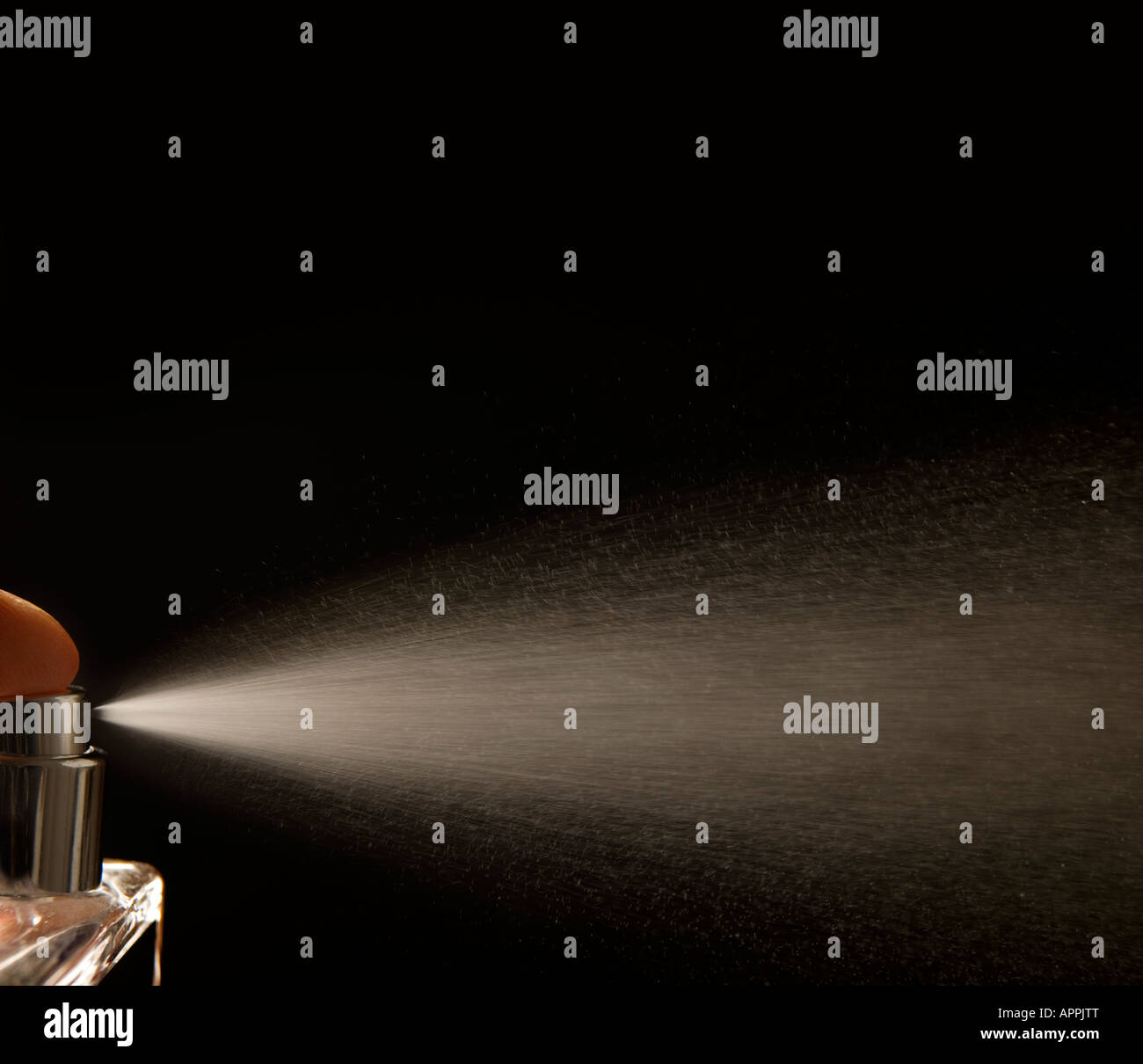 Spray aerosol against a black background Stock Photo - Alamy
