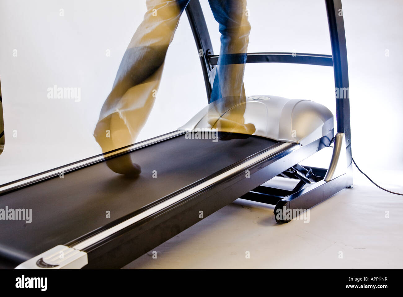 Running machine in use Stock Photo - Alamy