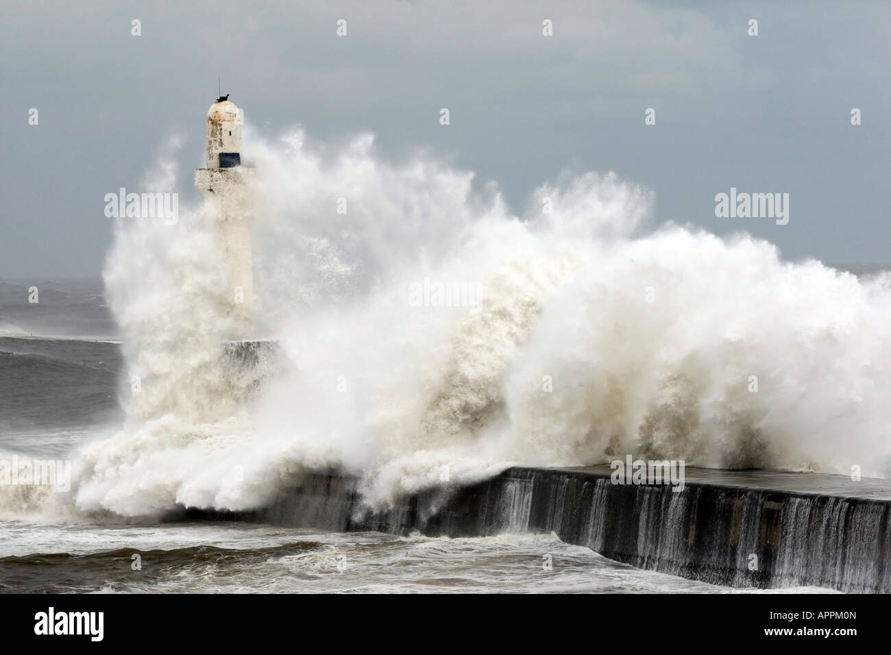 Huge wave hits the breakwater at the entrance to Aberdeen Harbour in ...