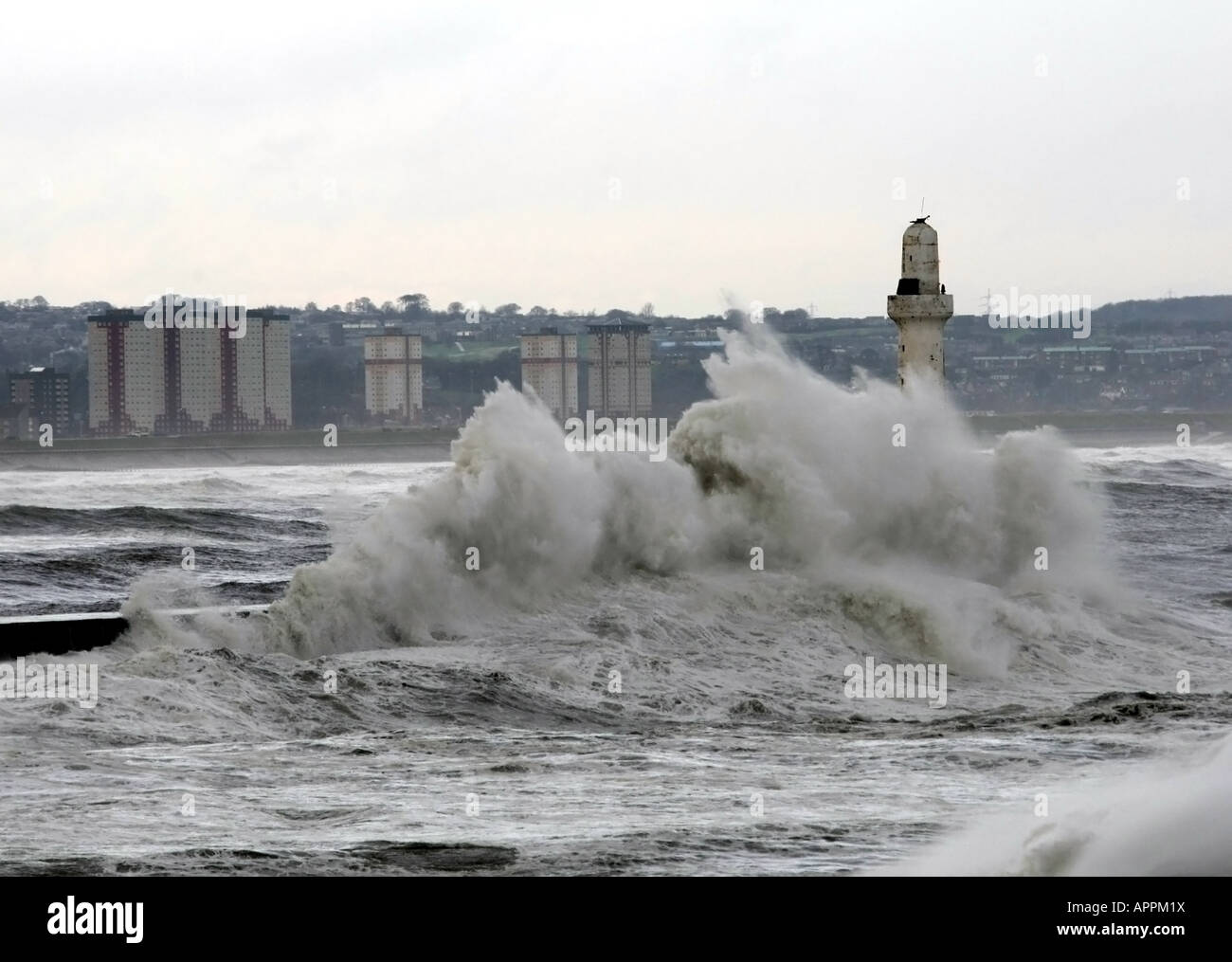 Huge wave hits the breakwater at the entrance to Aberdeen Harbour in ...