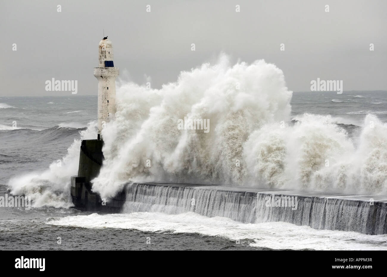 Huge wave hits the breakwater at the entrance to Aberdeen Harbour in ...