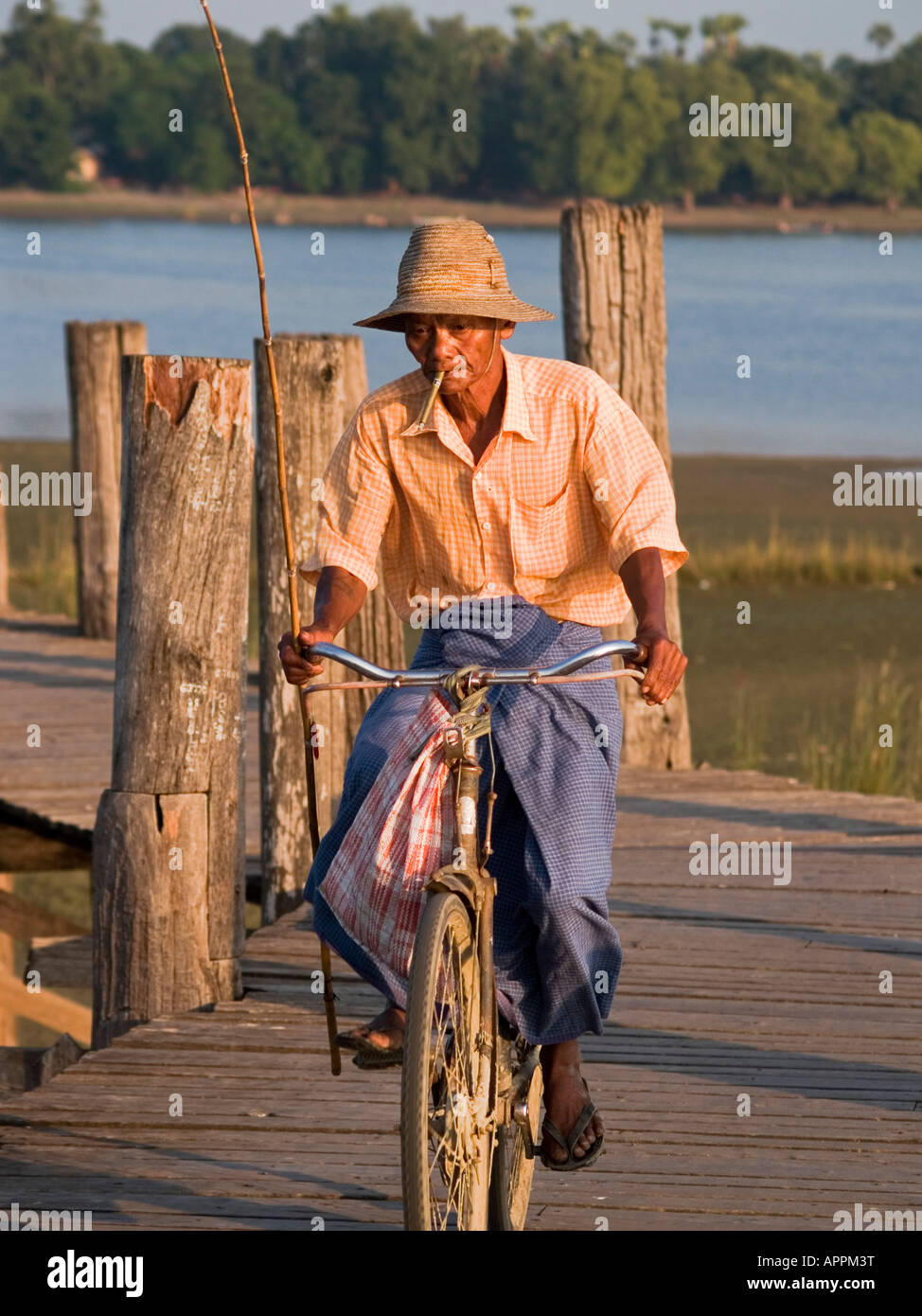 Burmese fisherman riding his bicycle Stock Photo - Alamy