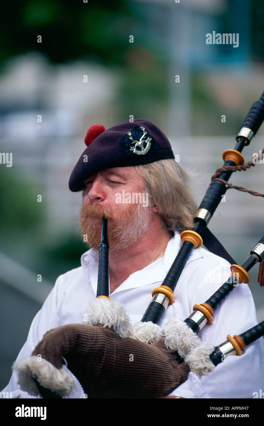 A Scottish piper playing the bagpipes in Canada Stock Photo - Alamy