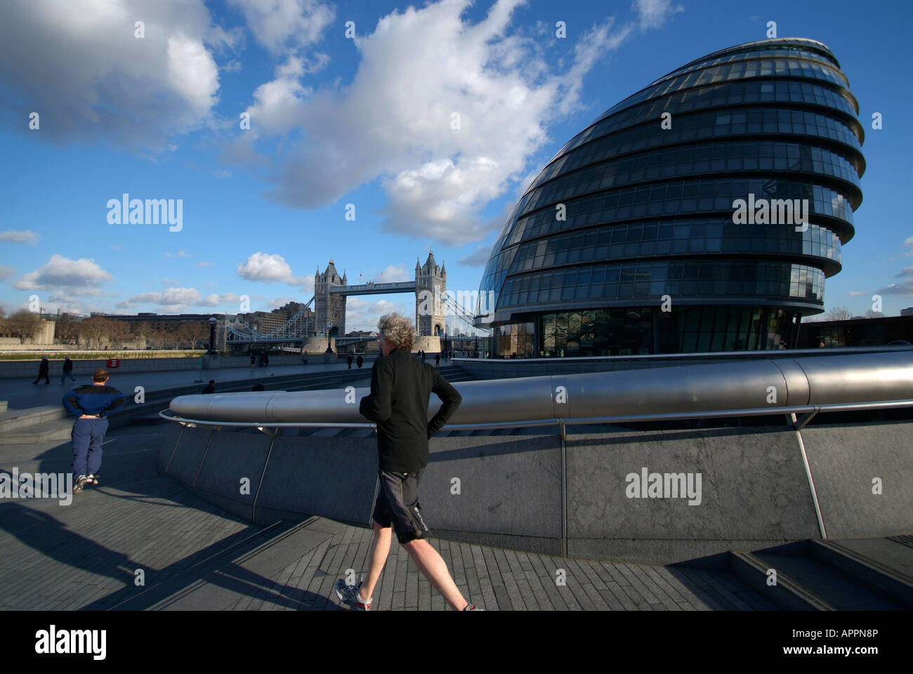 Jogging in London around City hall Stock Photo - Alamy
