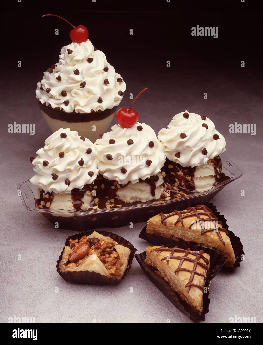 Assorted desserts hot fudge ice cream sundae three dips chocolate snack ...