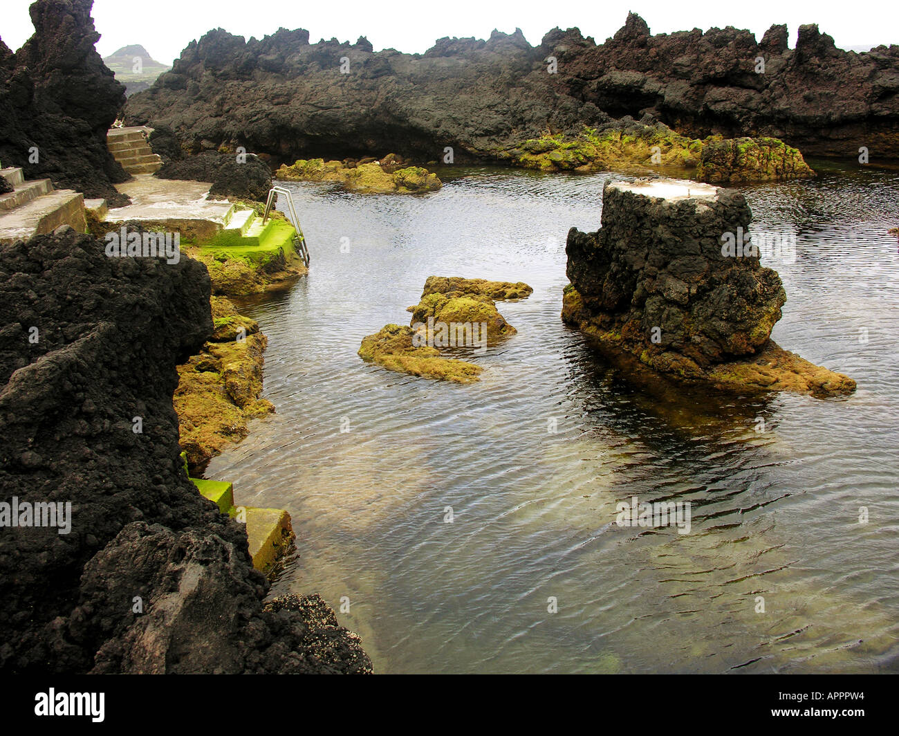 Natural swimming pools carved into the shore rock at Biscoitos Terceira ...