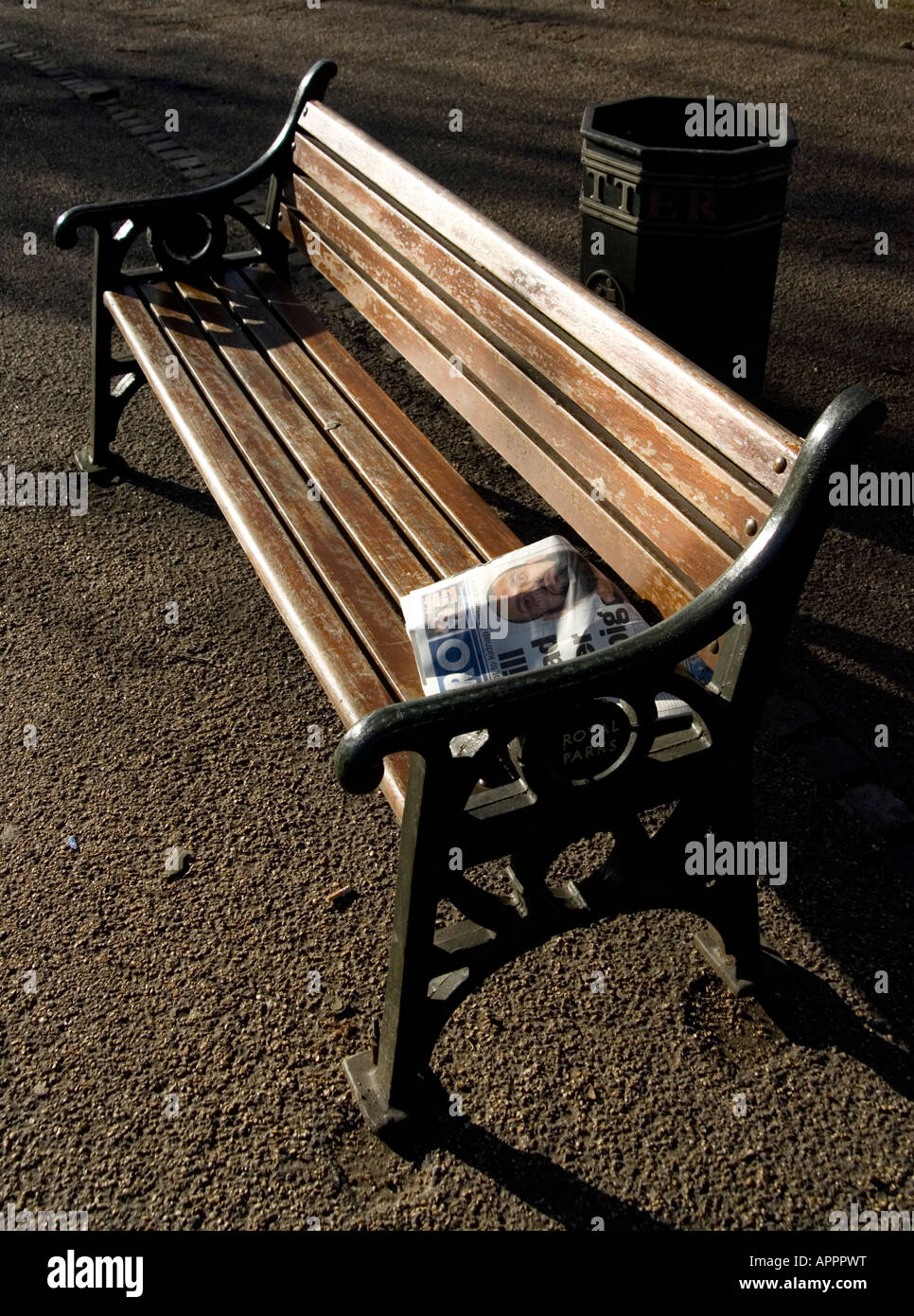 Discarded newspaper on a bench in Hyde Park, London Stock Photo - Alamy