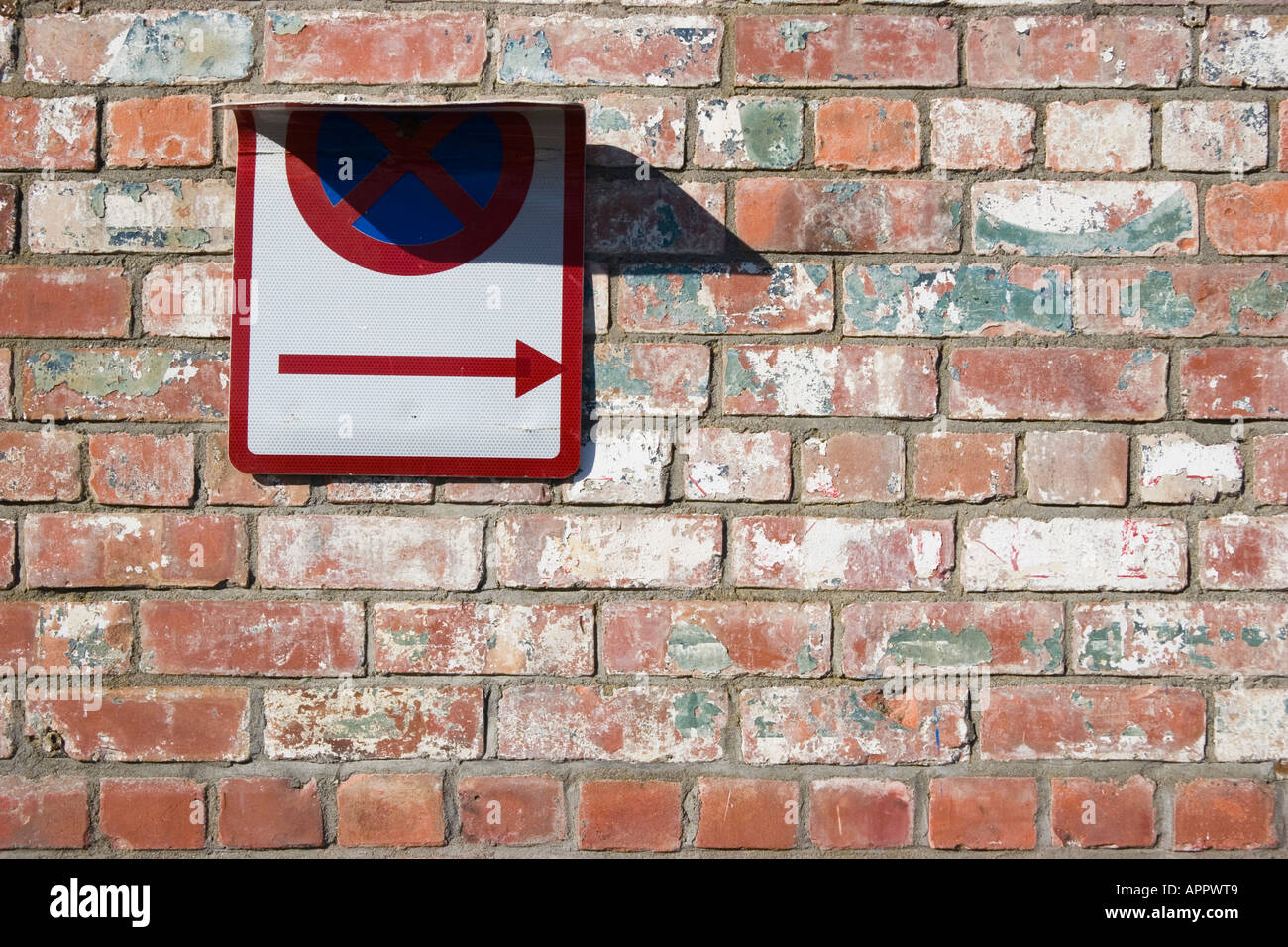 bent no entry sign on brick wall Stock Photo - Alamy