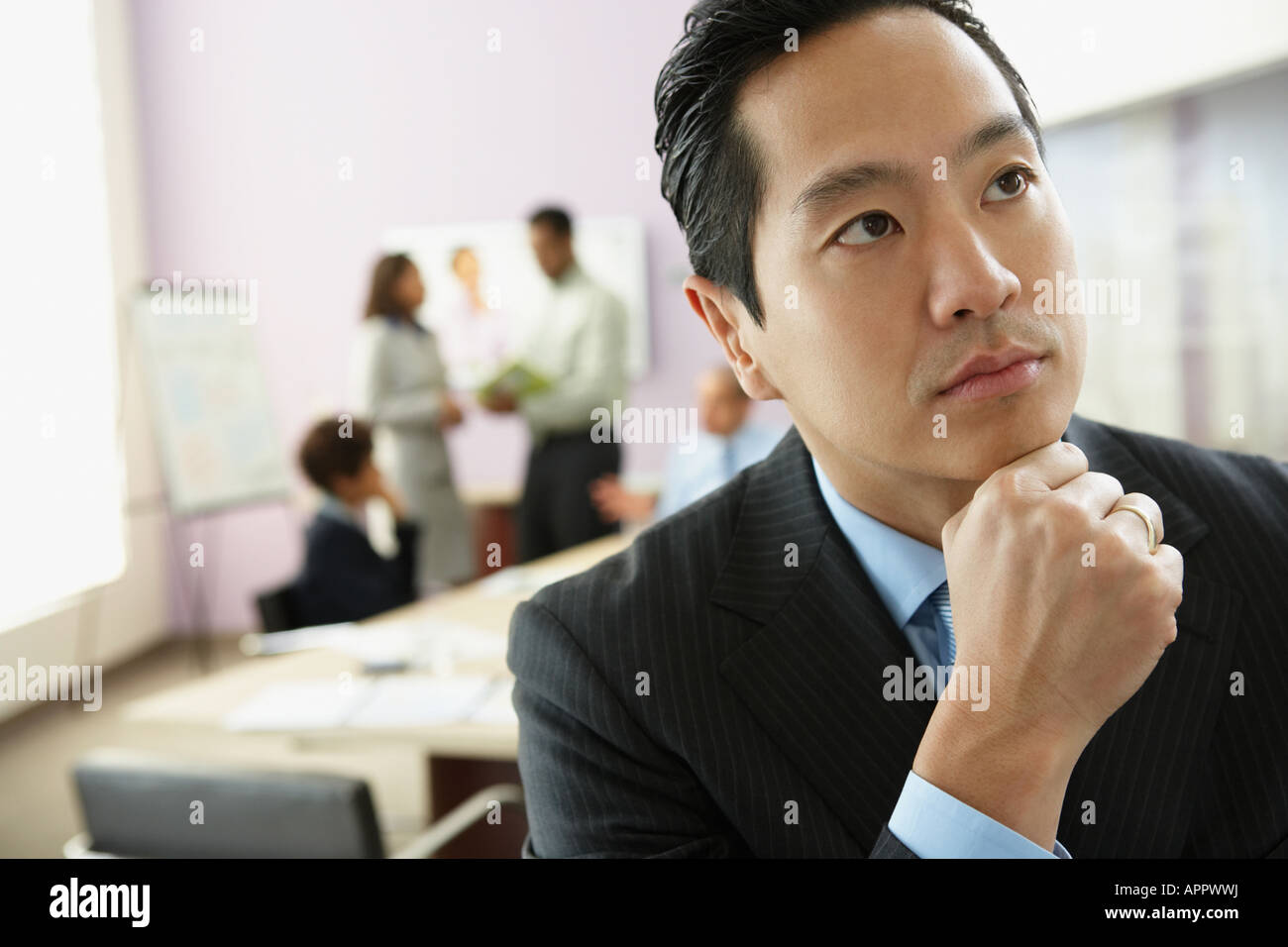 Asian businessman thinking Stock Photo - Alamy