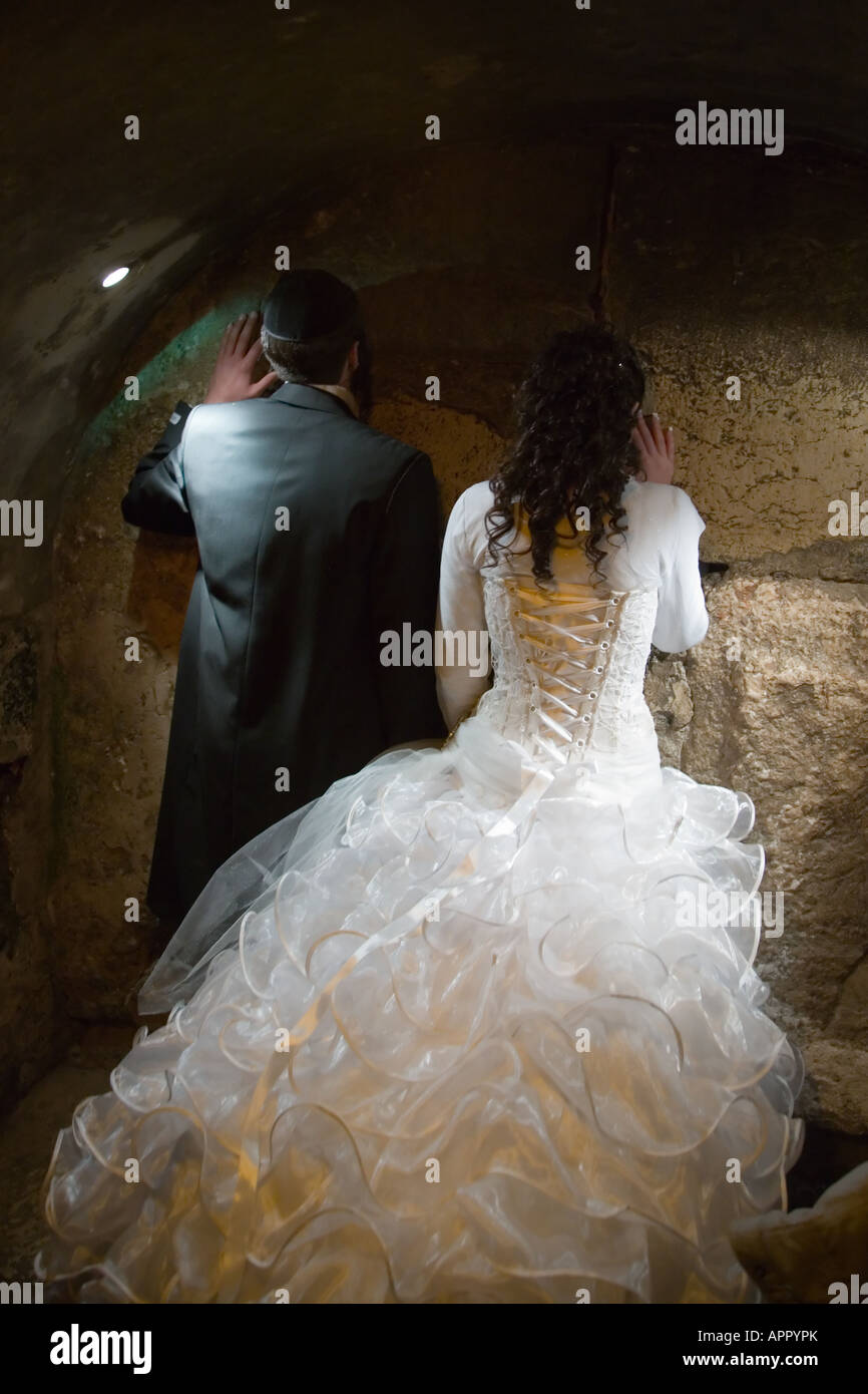 Stock Photo of Religious Jewish Bride and Groom Praying at the Wailing ...