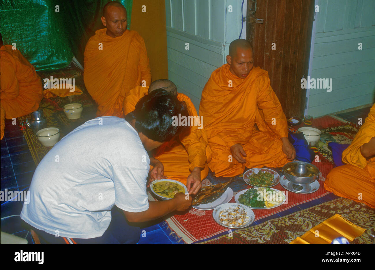 Feeding monks at a wedding ceremony in a house at Bangkok Thailand ...
