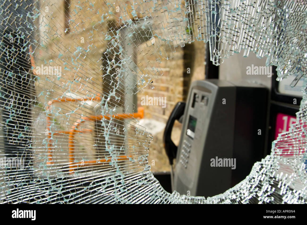 smashed up telephone box kiosk Stock Photo - Alamy