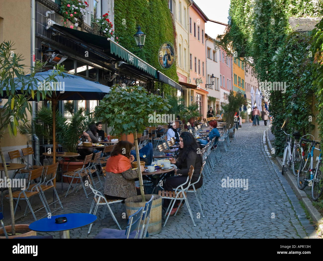 People at an outdoor restaurant patio Eastern Germany Stock Photo - Alamy