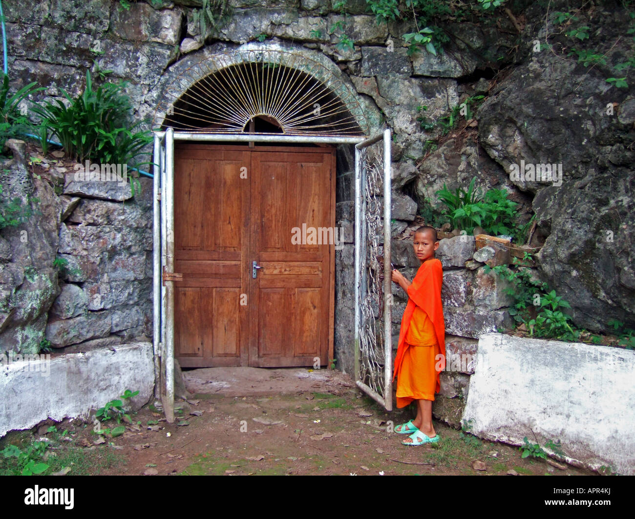 Buddhist monk opening temple door hi-res stock photography and images ...