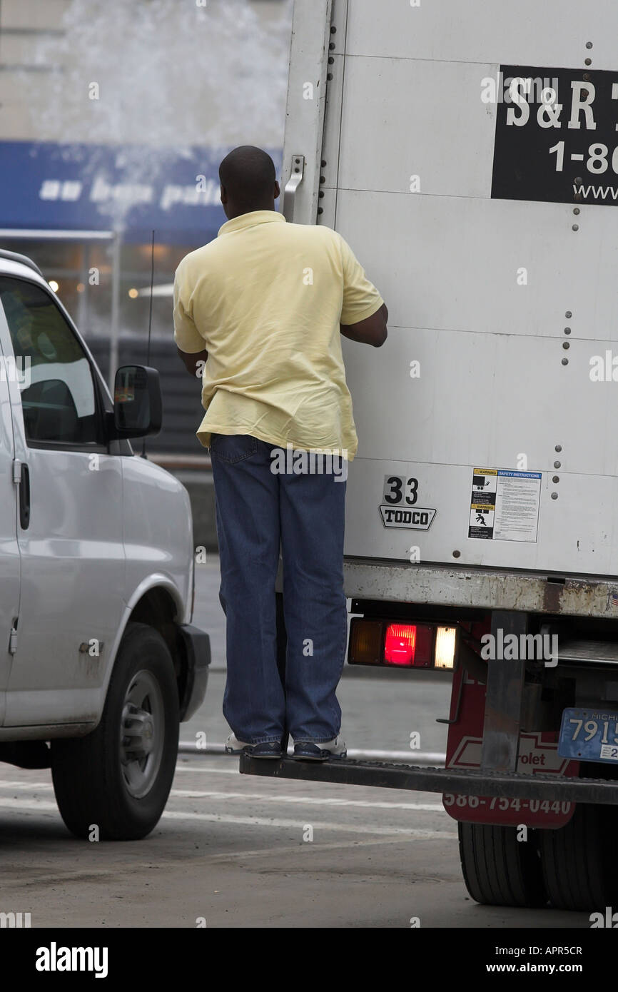Man riding on back truck hi-res stock photography and images - Alamy